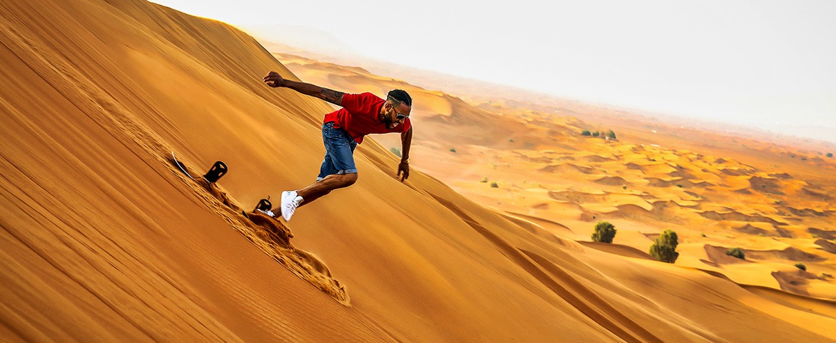 Sandboarding in Merzouga Desert - Merzouga Glamping